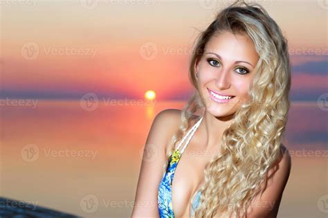 Portrait Of Smiling Blond Woman Stock Photo At Vecteezy