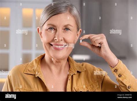 Menopause Hormone Replacement Therapy Happy Woman Holding Pill In