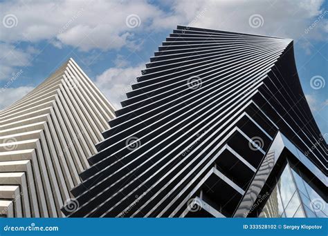 Close Up Of A Modern Glass Office Building Reflection Of The Sky With