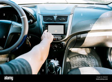 Close Up Of Driver Tuning Into The Radio Station Distracted Driver