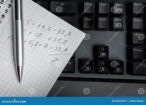 Pen And Notes With Arithmetic Calculations On Pc Keyboard Stock Image