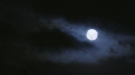 Bright Moon Shining Through Clouds On Dark Stock Footage SBV 300203127