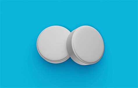 3 D イラスト薬の丸薬 1 つの丸薬の他の丸薬トップ ビューで青の背景に影 プレミアム写真