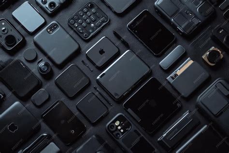 A Closeup Of Various Futuristic Black Devices On A Dark Background Lit