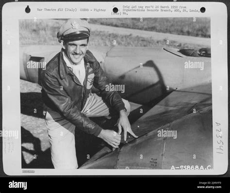 A Pilot Of The 94th Fighter Squadron 1st Fighter Group Stands Beside