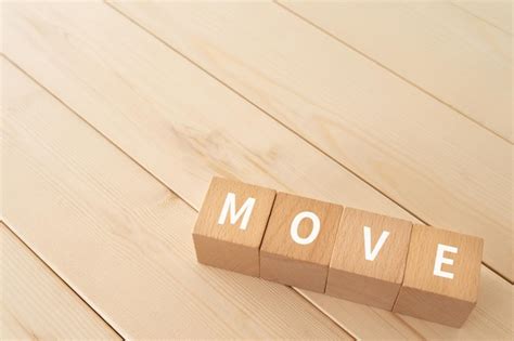 premium photo wooden blocks with move text of concept on the wooden
