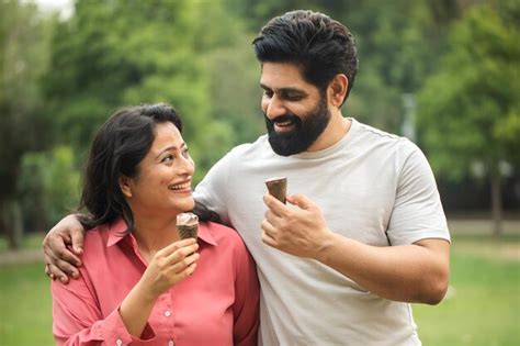 Cheerful Siblings Playing Video Game At Home Premium Ai Generated Image