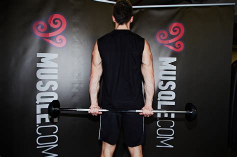 Standing Palms Up Barbell Behind The Back Wrist Curl Musqle
