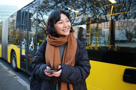 Premium Photo Portrait Of Korean Girl Buying Ticket For Public