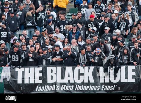 Raider Fans During Game Action At The Oakland Coliseum Also Known As