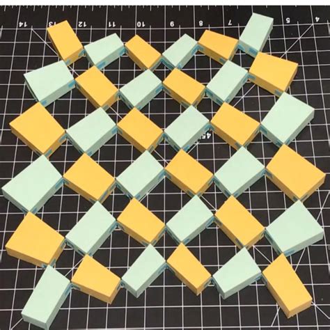 Reconfigurable Kirigami Rrhinograsshopper