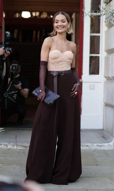 Rita Ora In A Pink Top Attends The Typebea Haircare Launch Event In