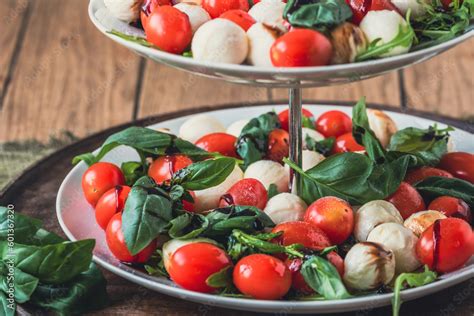 Classic Italian Salad Insalata Caprese With Cherry Tomatoes Mini Mozarella Pearls Basil Leaves