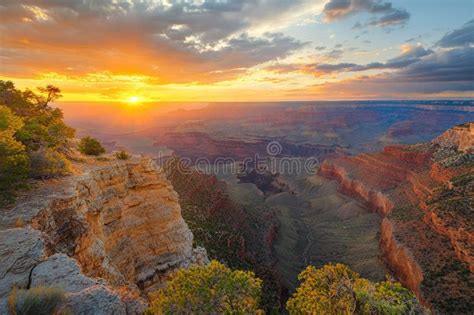 A Stunning Canyon Stretches Across The Horizon Bathed In The Warm