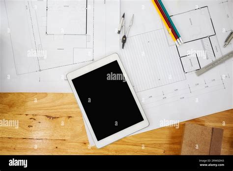 Construction Blueprints With Tools And Tablet Top View Tablet With Architectural Blueprints