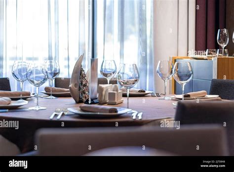 An Empty Table With Dishes In A Cafe Or Restaurant Against The Backdrop