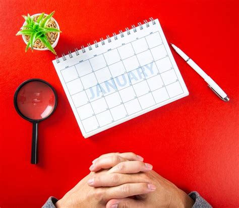 Premium Photo Close Up Of Calendar On Red Background Planning For