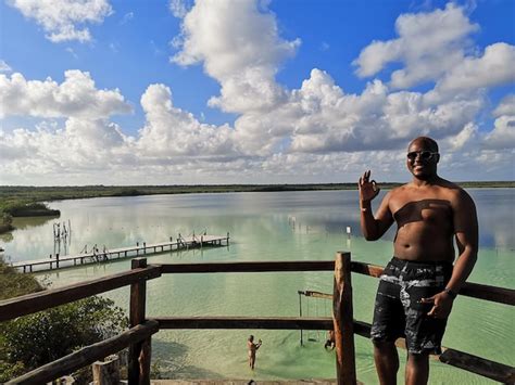 Premium Photo Portrait Of Shirtless Man Standing Against Sea