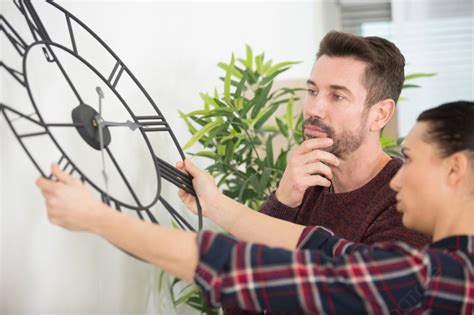 Couple Install Round Wall Clock Photo Background And Picture For Free Download Pngtree