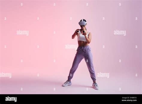 Enjoying A Virtual Reality Game Happy Young Woman Smiling Cheerfully