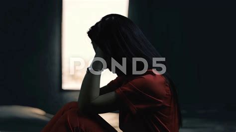 A Girl Sitting Alone And Crying