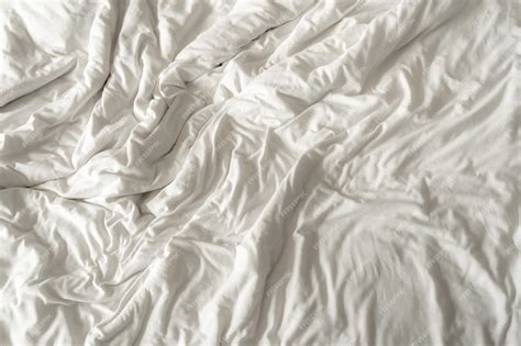 Premium Photo The Texture Of The White Bedsheet Is Wrinkled