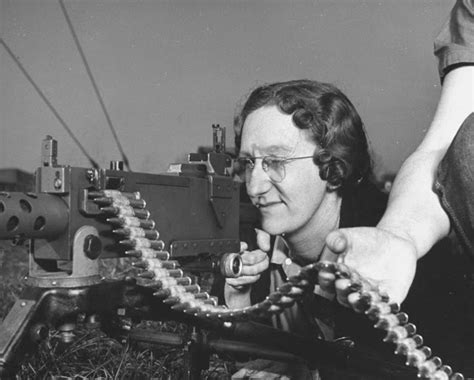Vintage Photographs Of Women Testing Weapons During World War Ii At