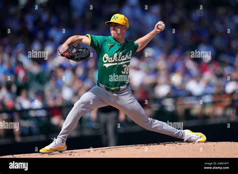 Oakland Athletics Starting Pitcher Jp Sears Throws To A Chicago Cubs Batter During The First