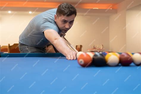 Premium Photo Man Holding Hand On Pool Table Playing Snooker Or