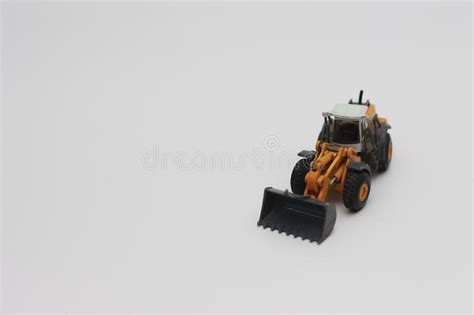 A Close Up Of Miniature Orange Wheel Loader Toy Stock Image Image Of