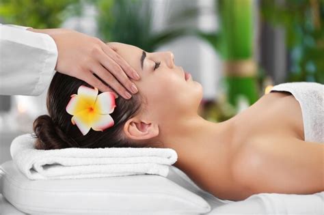 Premium Photo Beautiful Young Woman Relaxing With Face Massage At
