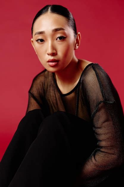 Premium Photo Fashion Asian Woman In Sheer Top And Black Pants