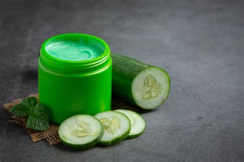 Free Photo Face Mask With Cucumber Slices On Dark Background