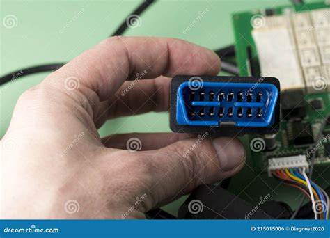 Electrician Holds In Hands Car Diagnostic Error Scanner OBD Plug