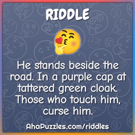 He Stands Beside The Road In A Purple Cap At Tattered Green Cloak