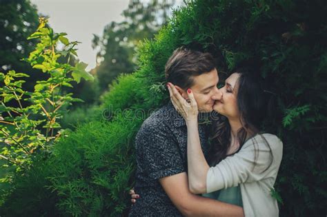 Cute Couple Kissing In The Park On A Sunny Day Stock Image Image Of