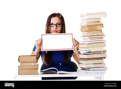 Beautiful Young Woman Stuydent Wih Stack Of Books And Holding Co Stock