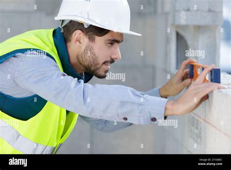Man Bricklayer Is Measurement Level Stock Photo Alamy