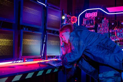 Asian Woman Wearing A Black Jacket Hacking Programming System And