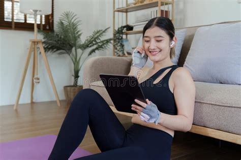 Healthy Asian Woman Practicing Relaxation Yoga At Home Spending Time