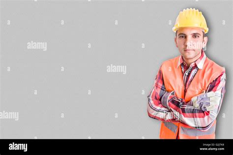 Portrait Of Handsome Constructor With Protection Equipment And Helmet