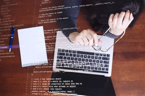 Programmer Working On Laptop Computer And Coding Code On Screen
