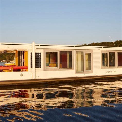 Crossboundaries Converts Houseboat Into Tiny Solar Powered Home Binke