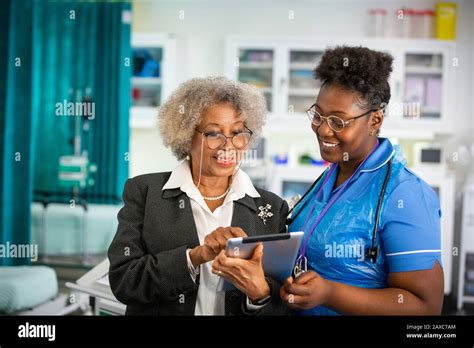 Senior Woman Doctor Tablet Hi Res Stock Photography And Images Alamy