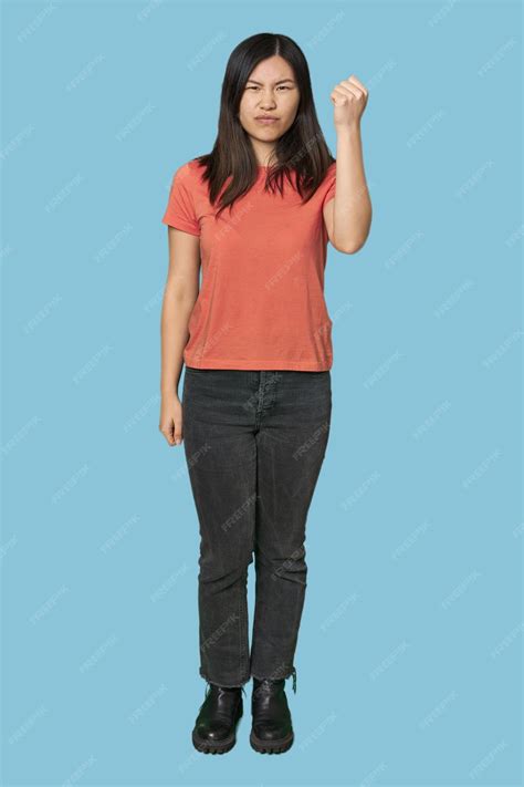 Premium Photo Fullbody Young Chinese Woman Showing Fist To Camera