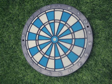 Premium Photo Dart With Grass Green Background