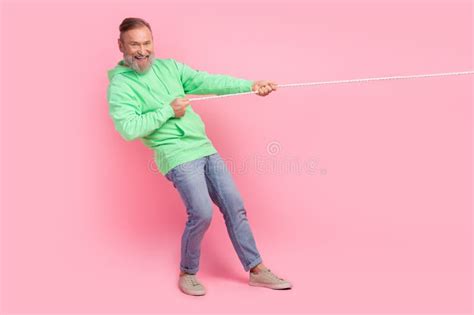 Full Size Photo Of Cool Pensioner Man Pulling String Strength Wear