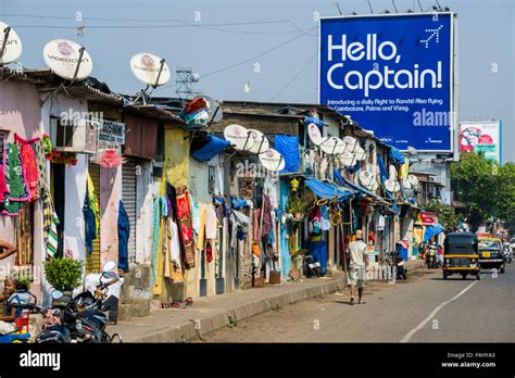 The Facades Of Typical Homes Of Poor Working Class Indians With Tv