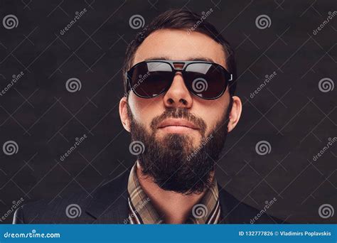 Close Up Portrait Of A Bearded Man Wearing A Suit And Sunglasses Stock
