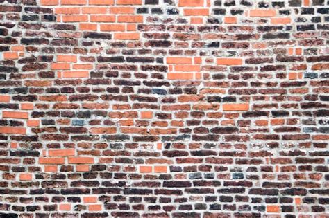 Asymmetric Clutch Of Small Brick In Brown Tones Premium Photo